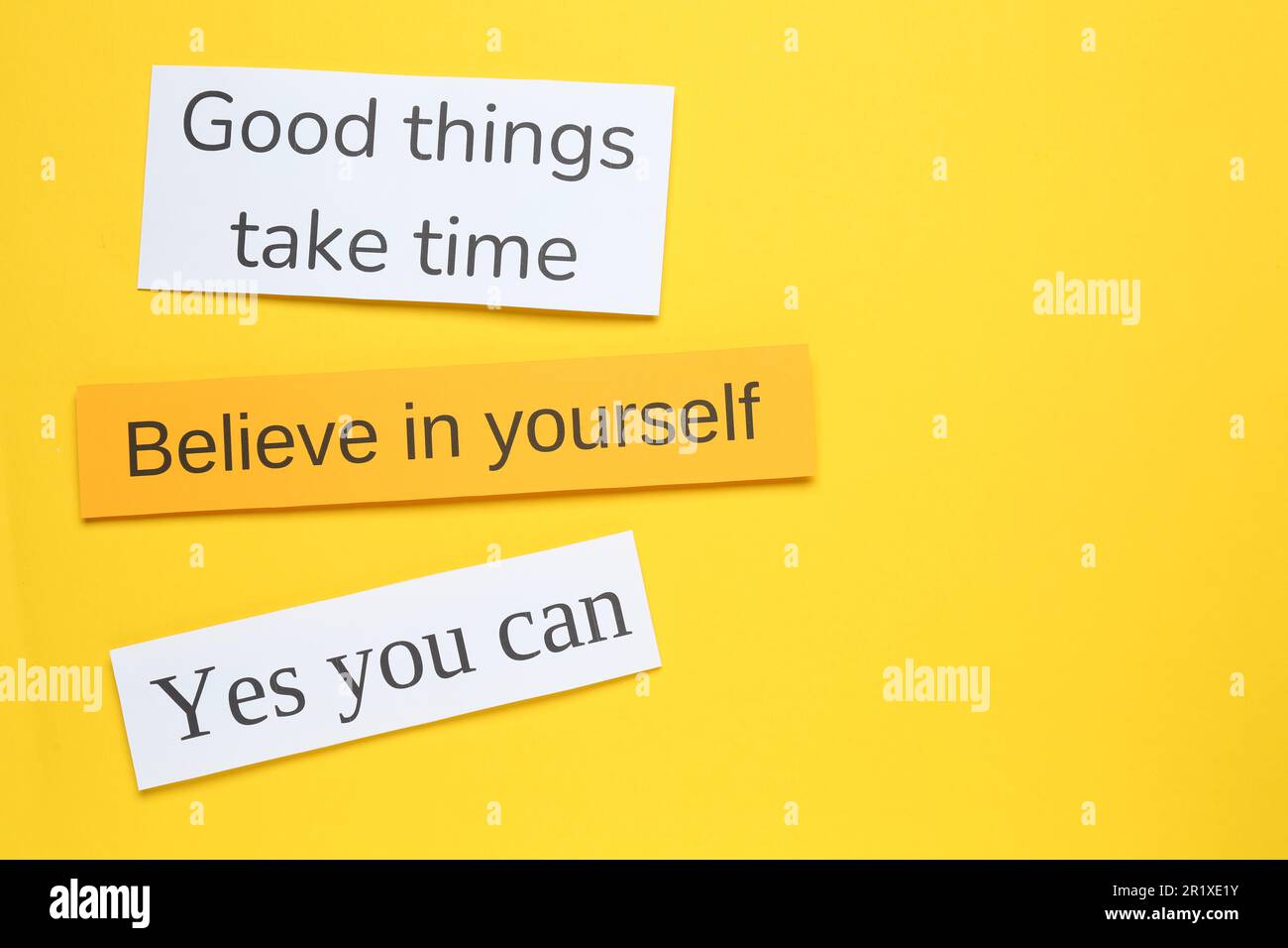 Notes with motivational quotes on yellow background, flat lay. Space ...