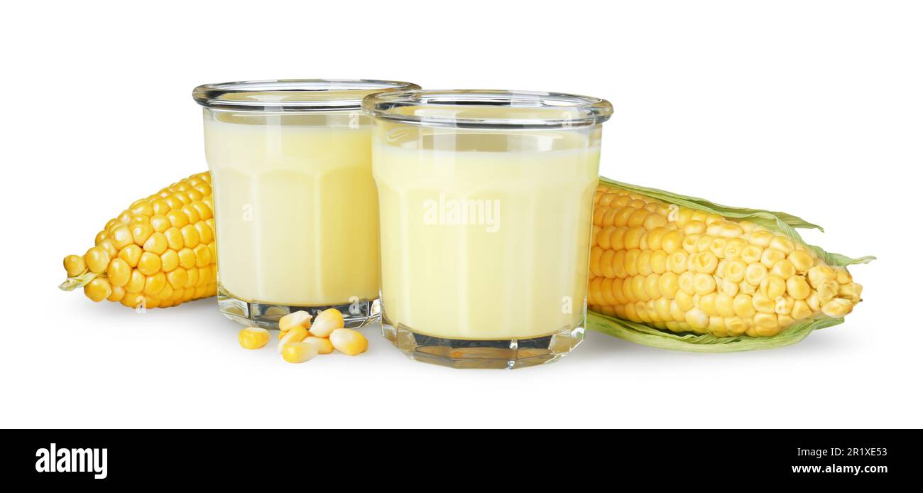 Tasty fresh corn milk in glasses and cobs on white background Stock ...