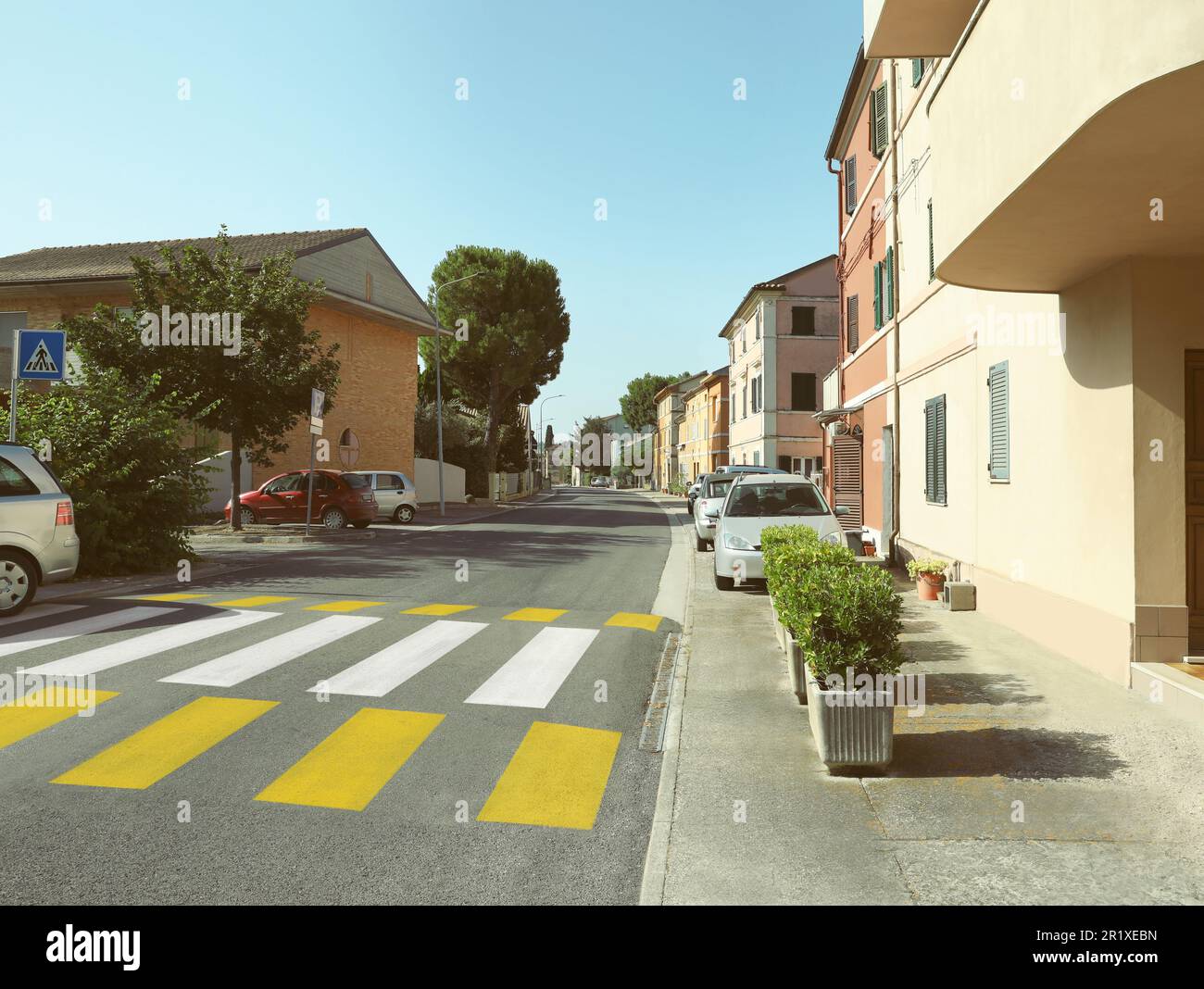 Many beautiful buildings and cars near crosswalk outdoors Stock Photo ...