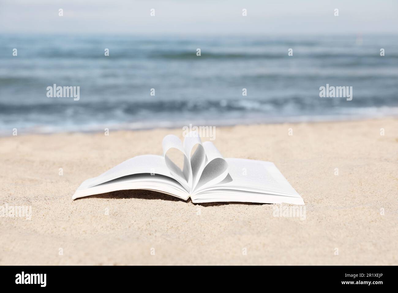 Open book on sandy beach hi-res stock photography and images - Alamy