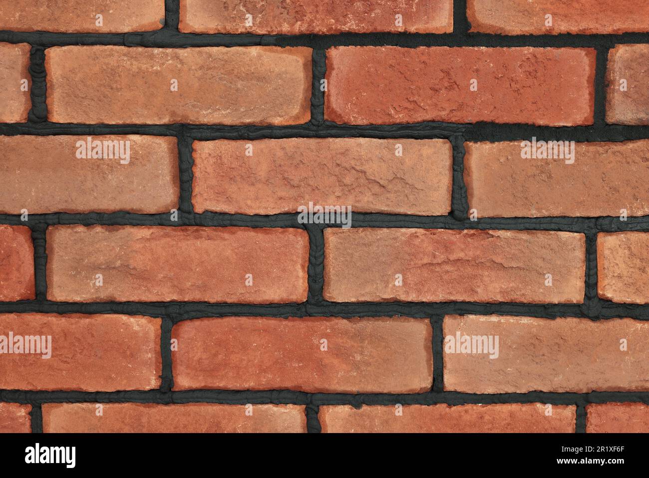 Decorative bricks on wall as background, closeup. Tiles installation ...
