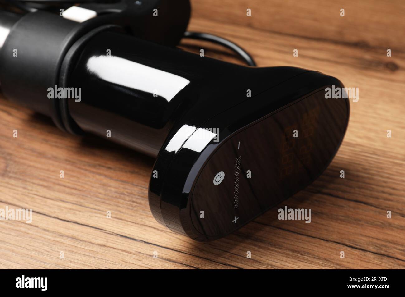 Thermal immersion circulator on wooden table, closeup. Sous vide cooker ...
