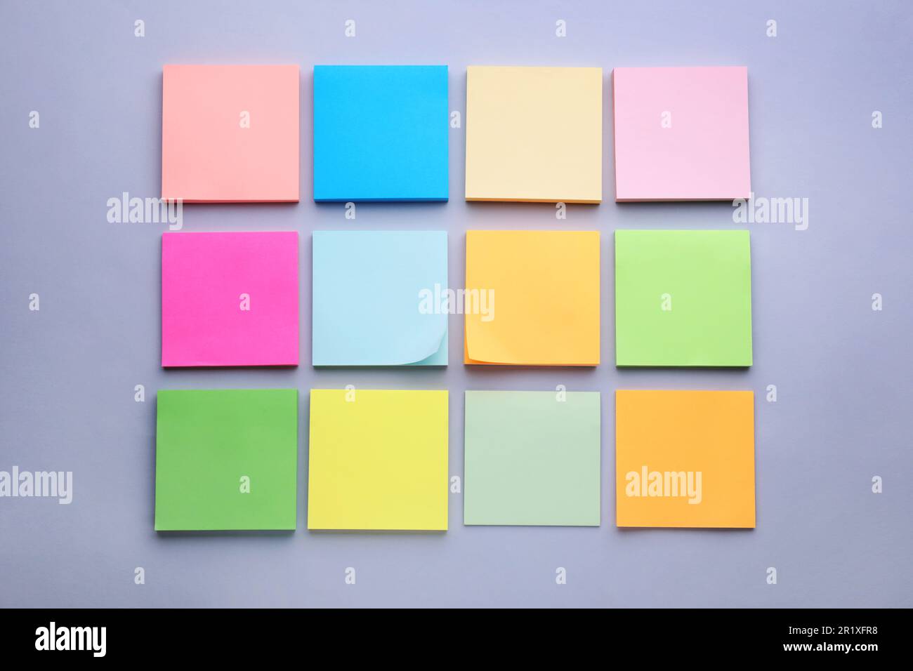 Paper notes on light purple background, flat lay Stock Photo - Alamy