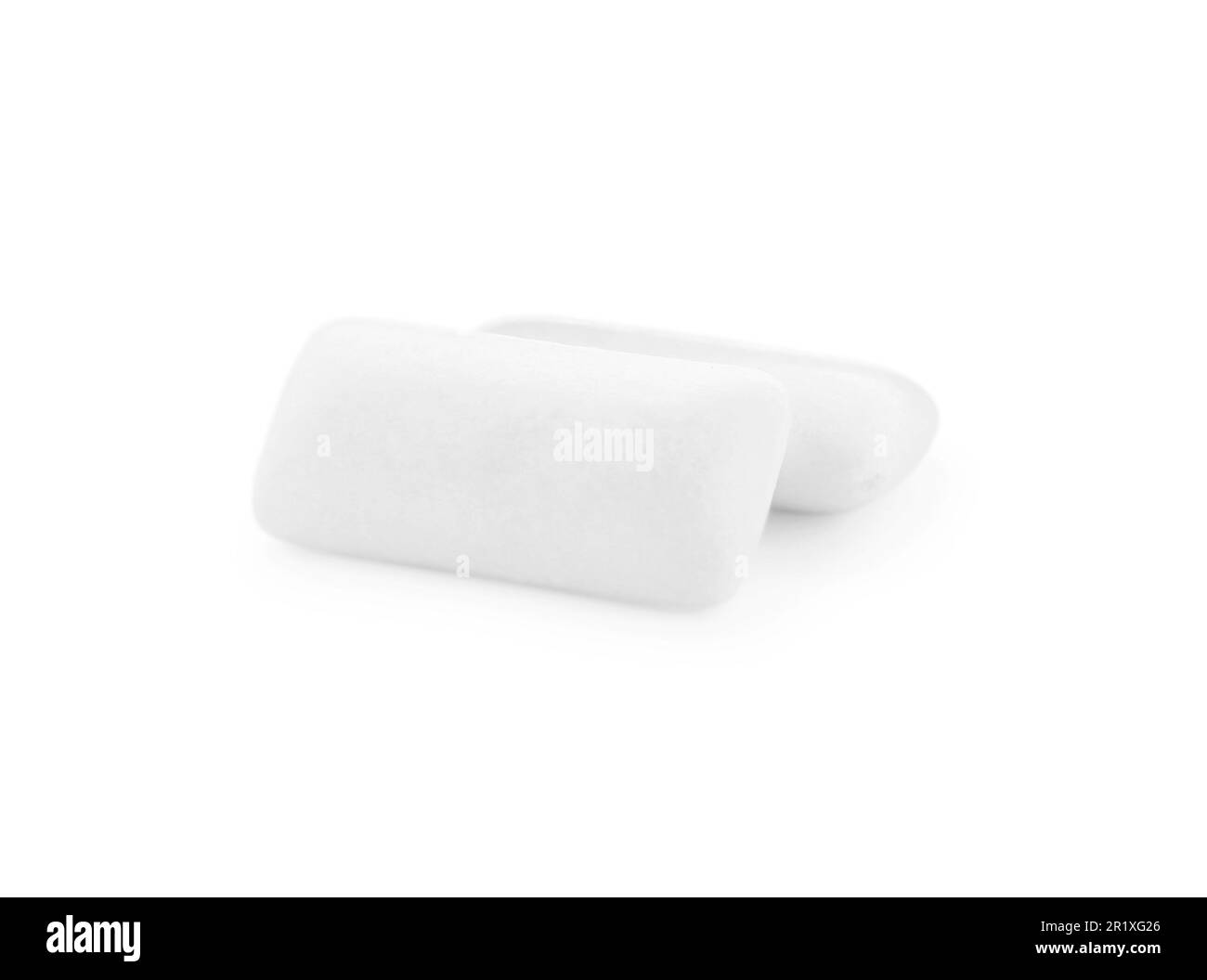 Two pieces of chewing gum on white background Stock Photo - Alamy