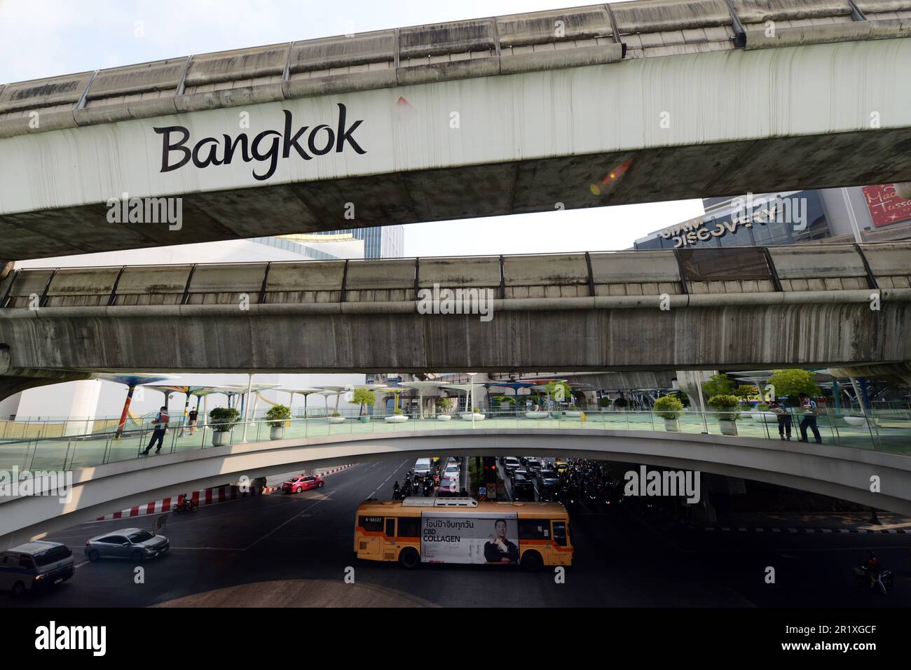 Walking on the OneSiam skywalk between MBK shopping center and Siam ...
