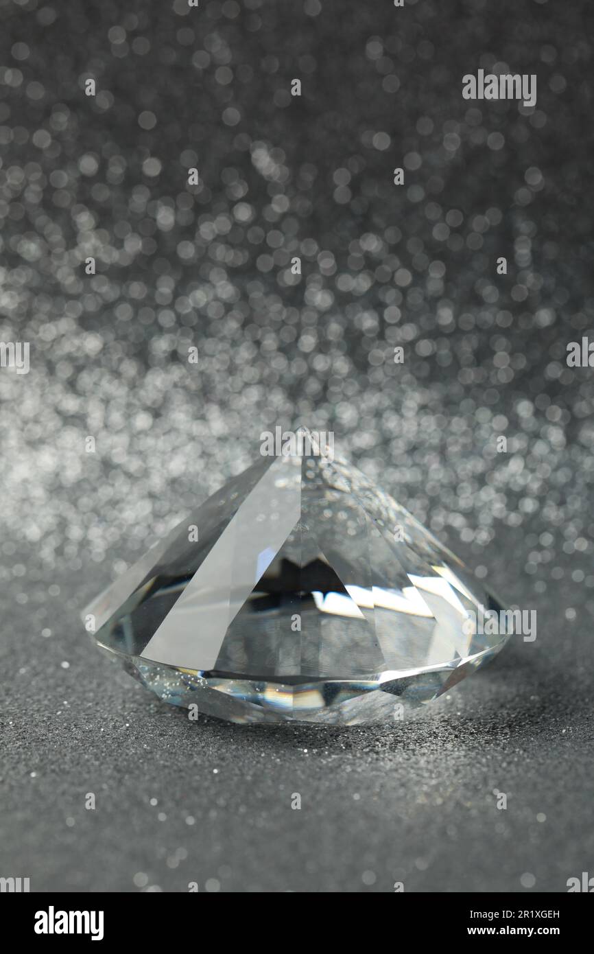 Beautiful dazzling diamond on shiny glitter background. Precious ...
