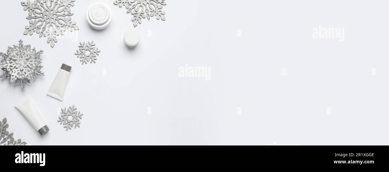 Winter skin care. Composition with cosmetic products and snowflakes on ...