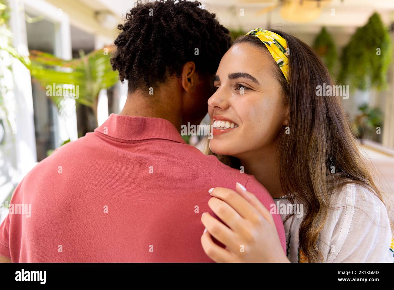 Happy diverse couple dancing and embracing in sunny garden Stock Photo ...