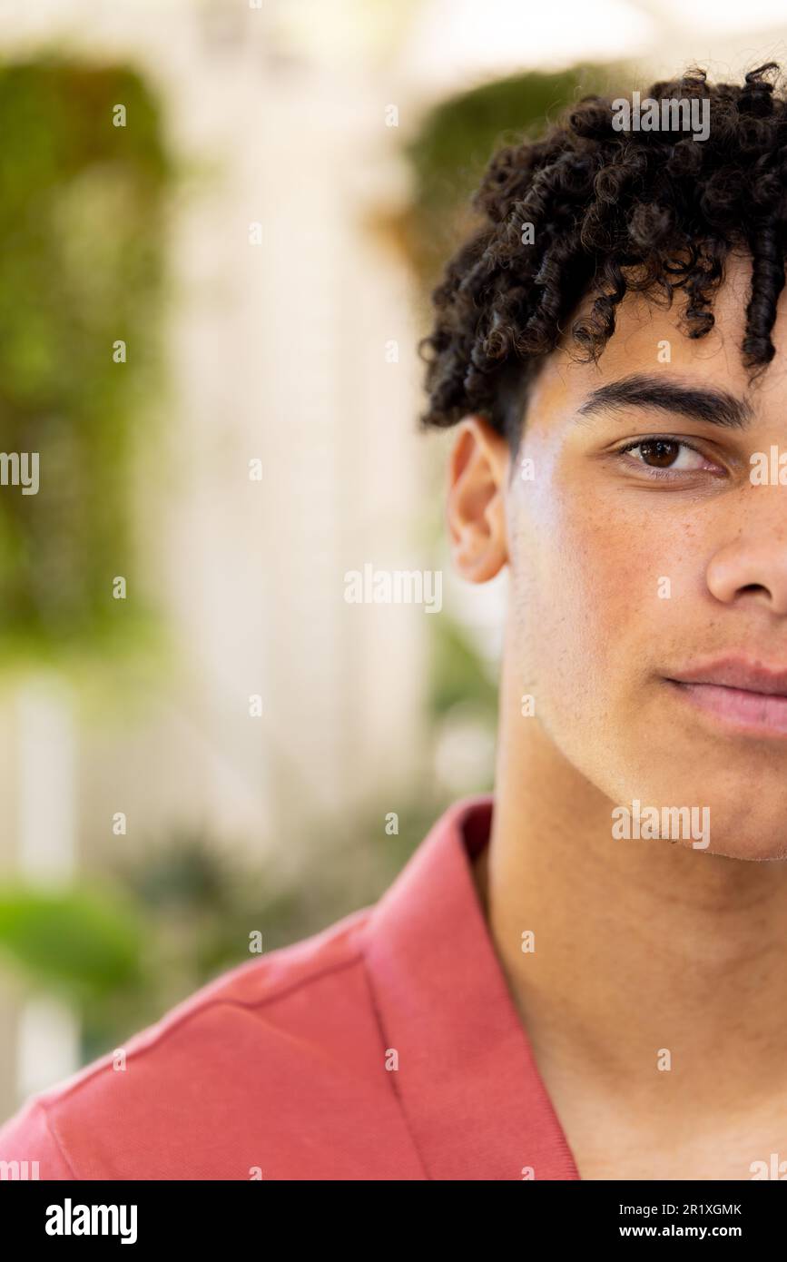 Half portrait of happy biracial man with curly black hair at home, with copy space Stock Photo ...