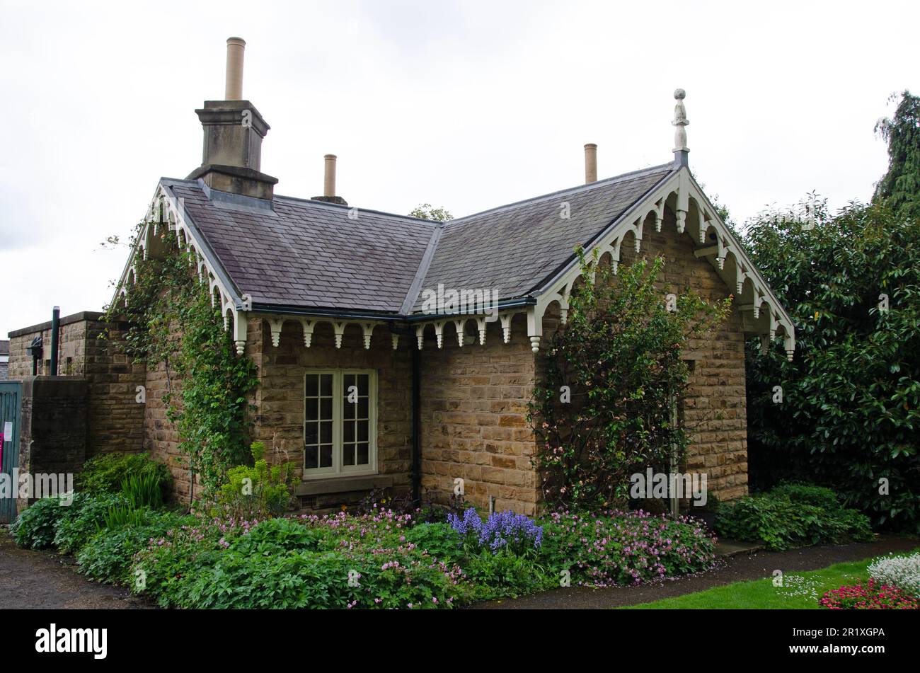 Small stone house with ornate roof fascia. Victorian style moulding and ...