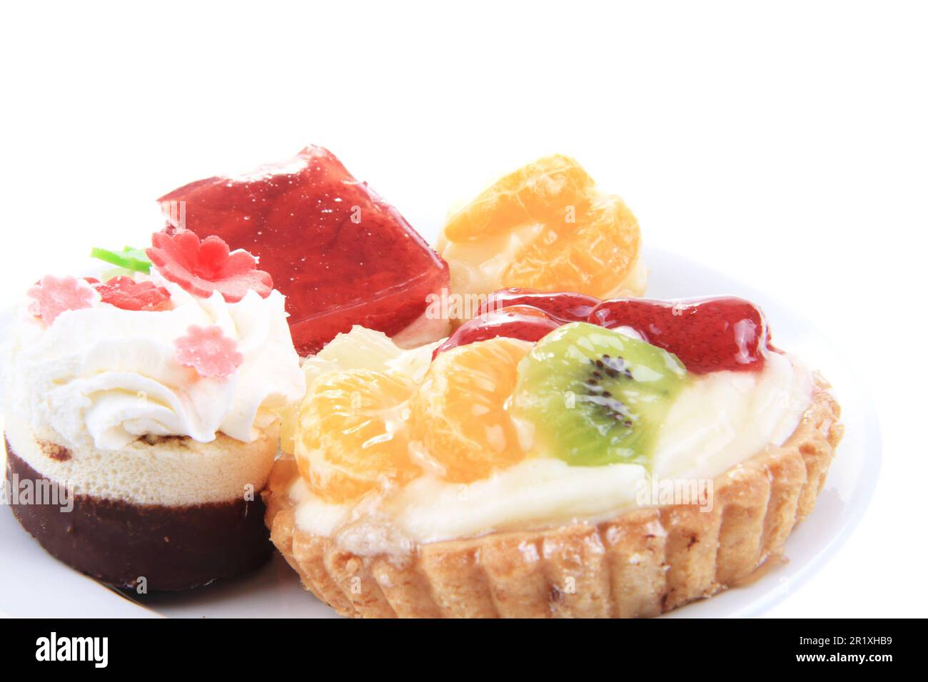 sweet color desserts isolated on the white background Stock Photo - Alamy