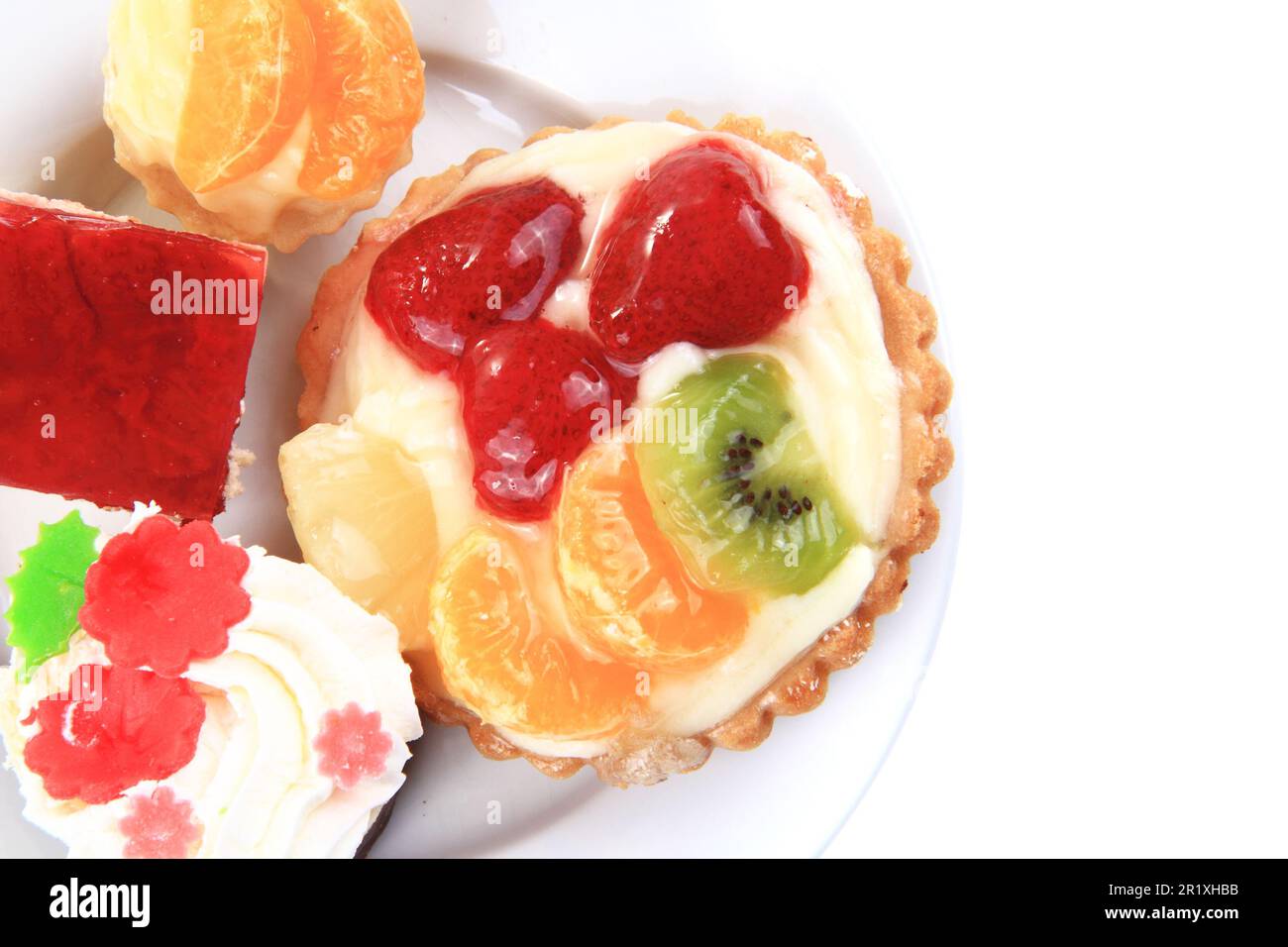 sweet color desserts isolated on the white background Stock Photo - Alamy