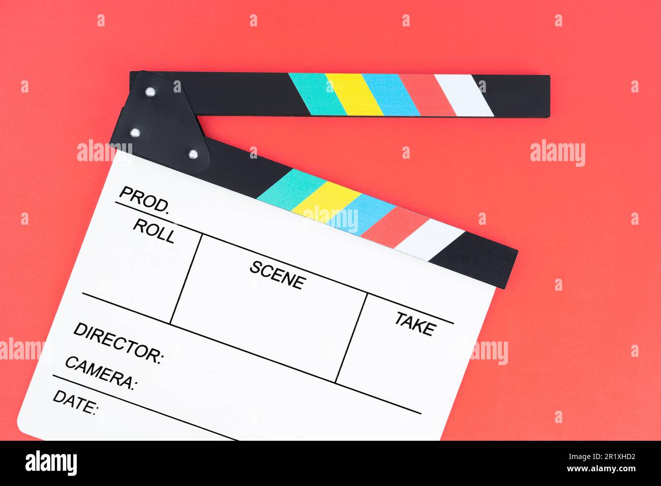 Filmmaker profession. Clapperboard on red background Stock Photo - Alamy
