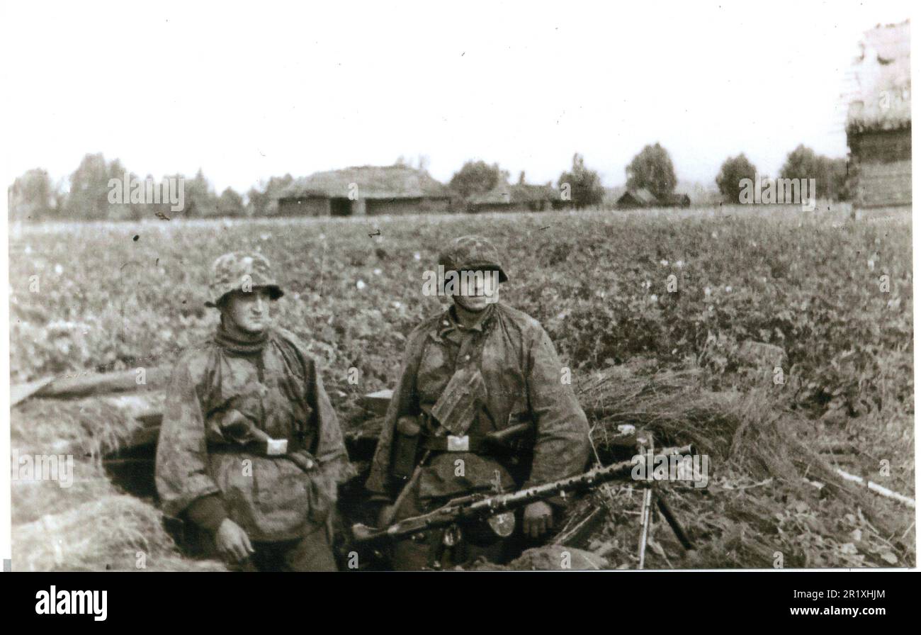 World War Two B&W photo Two German Soldiers in Camo Smocks in an MG ...