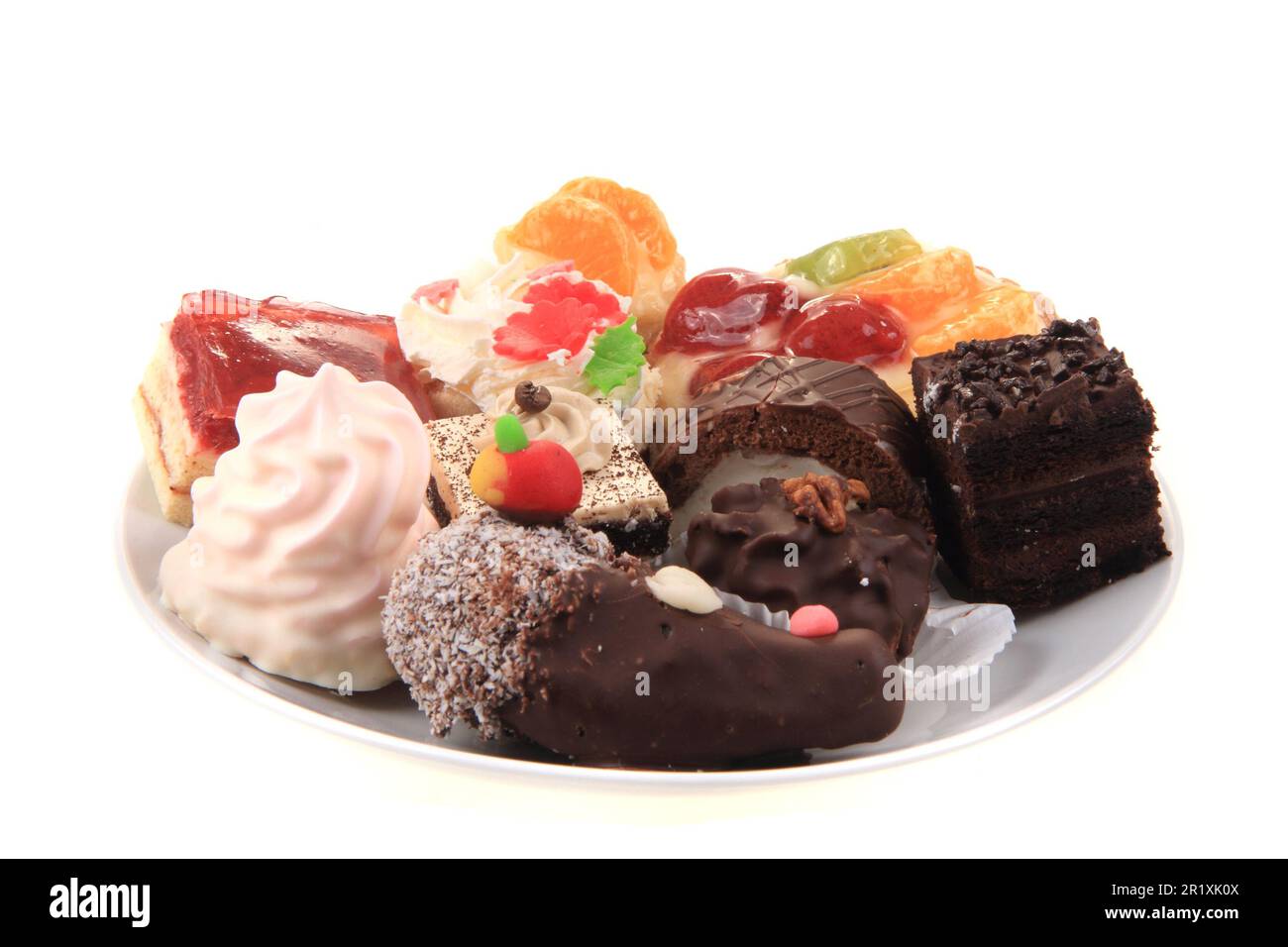 sweet color desserts isolated on the white background Stock Photo - Alamy