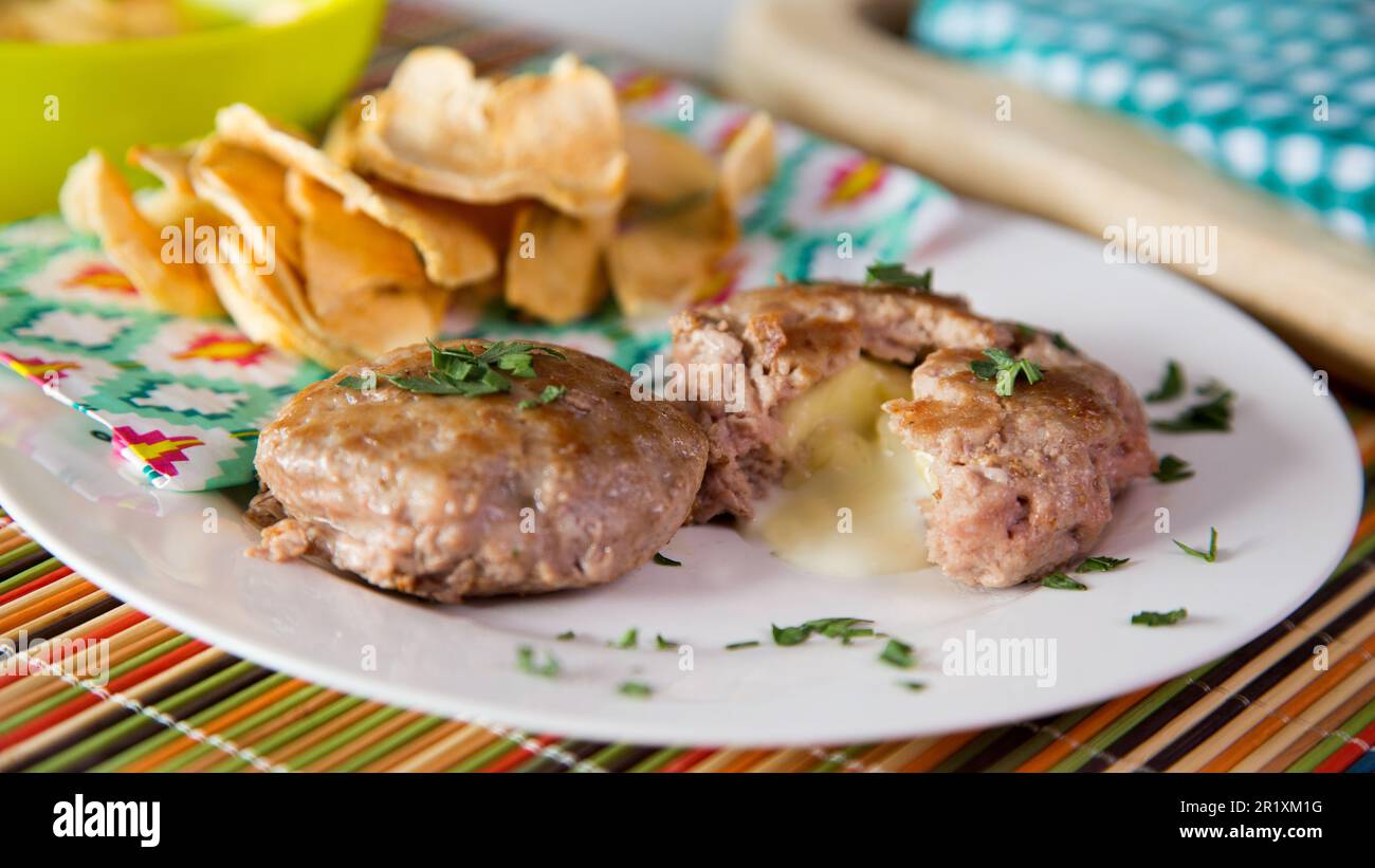 Two beef burgers stuffed with cheese Stock Photo - Alamy