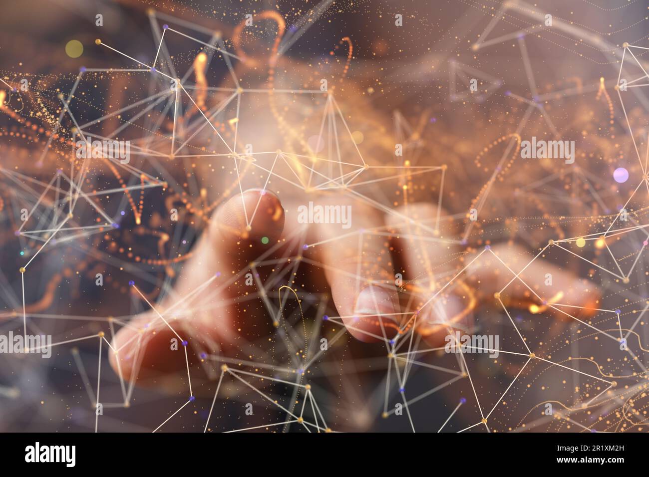 A person's hand reaching out to a big digital display of colorful dots ...
