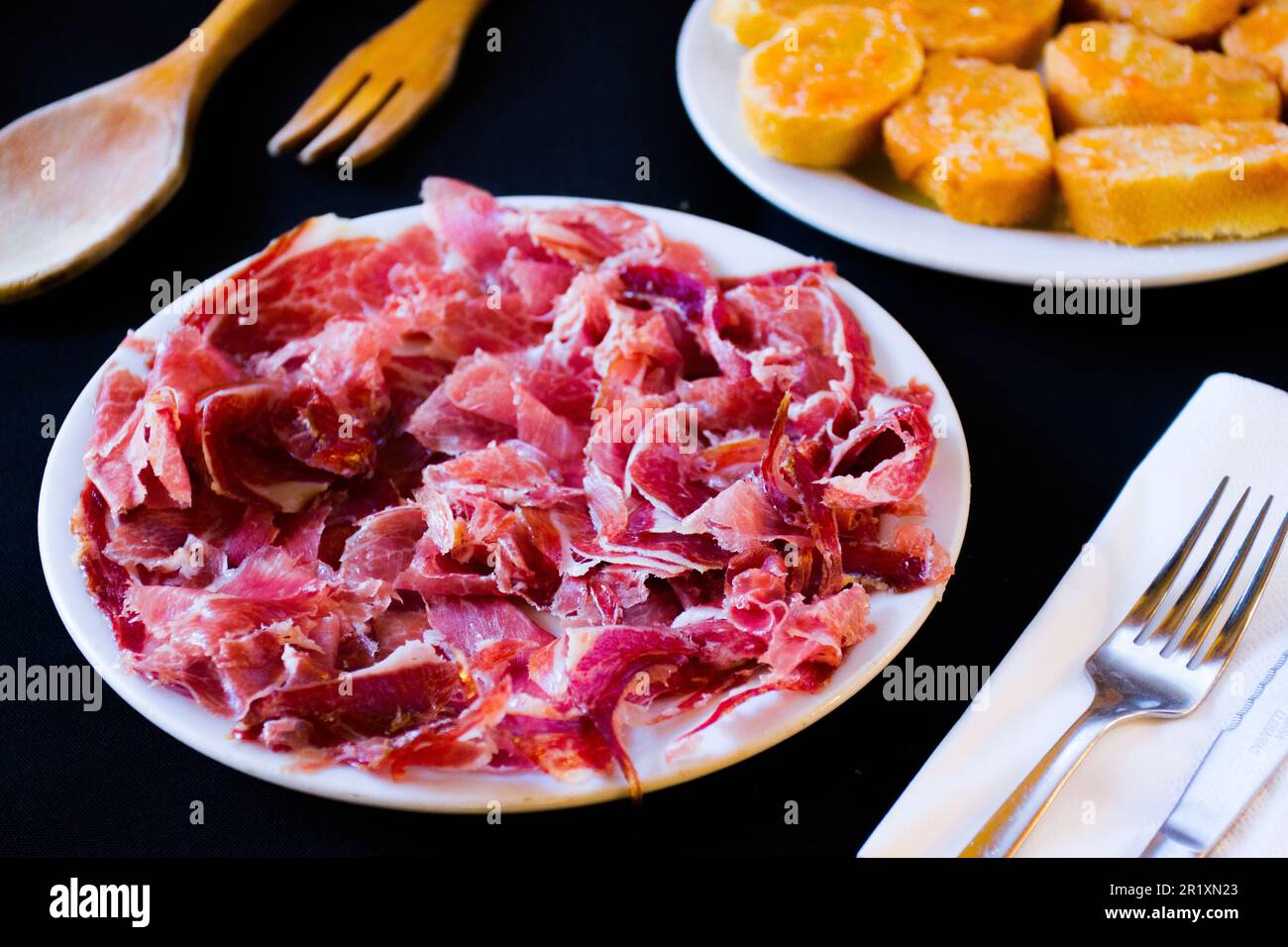 Spanish tapa of Iberian ham. Iberian ham is a type of serrano ham from ...
