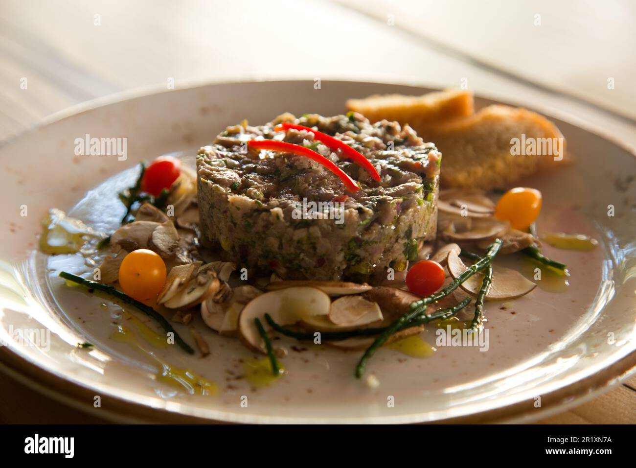 Minced meat tartar with marinated vegetables Stock Photo - Alamy