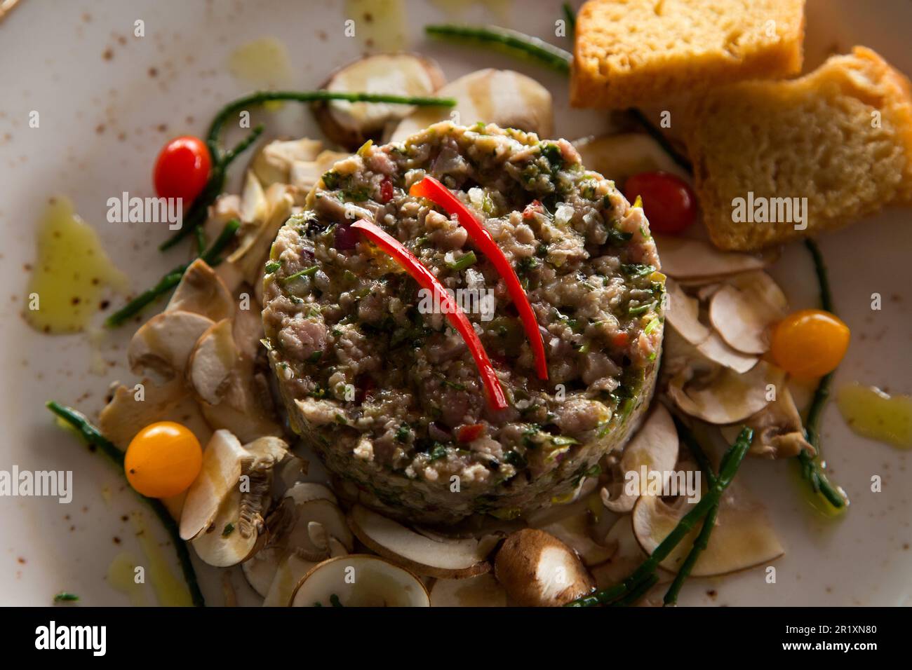 Minced meat tartar with marinated vegetables Stock Photo - Alamy