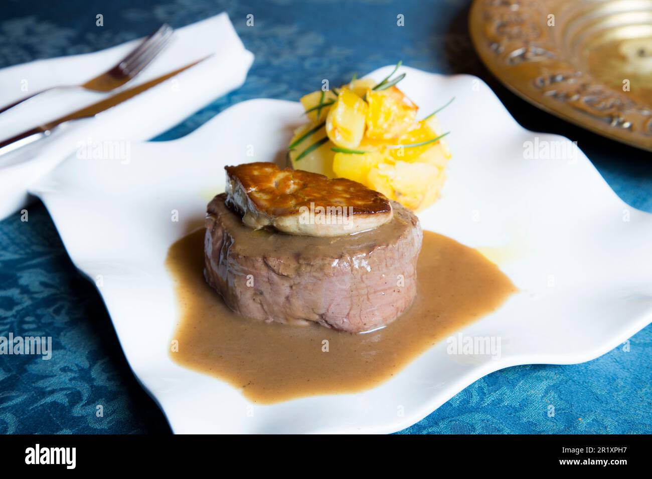 Beef tenderloin cooked at low temperature served with grilled foie ...