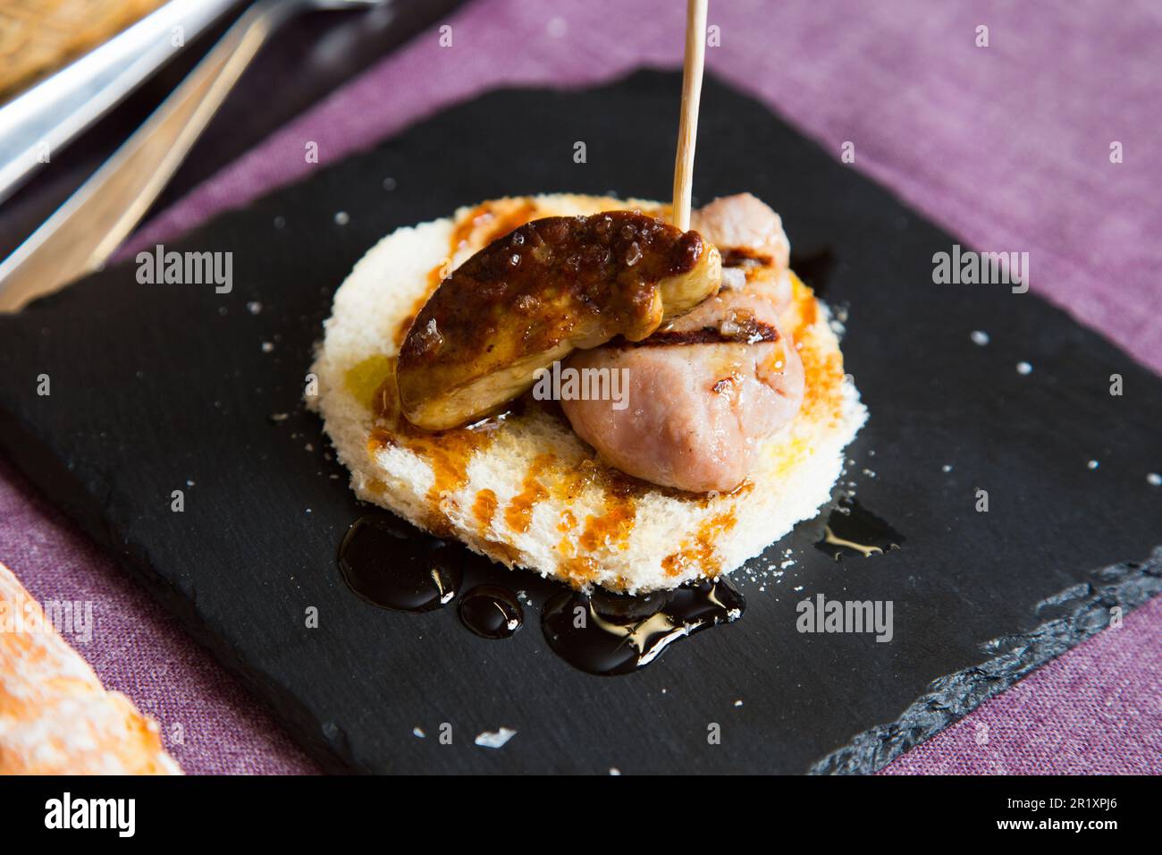 Beef tenderloin cooked at low temperature served with grilled foie ...