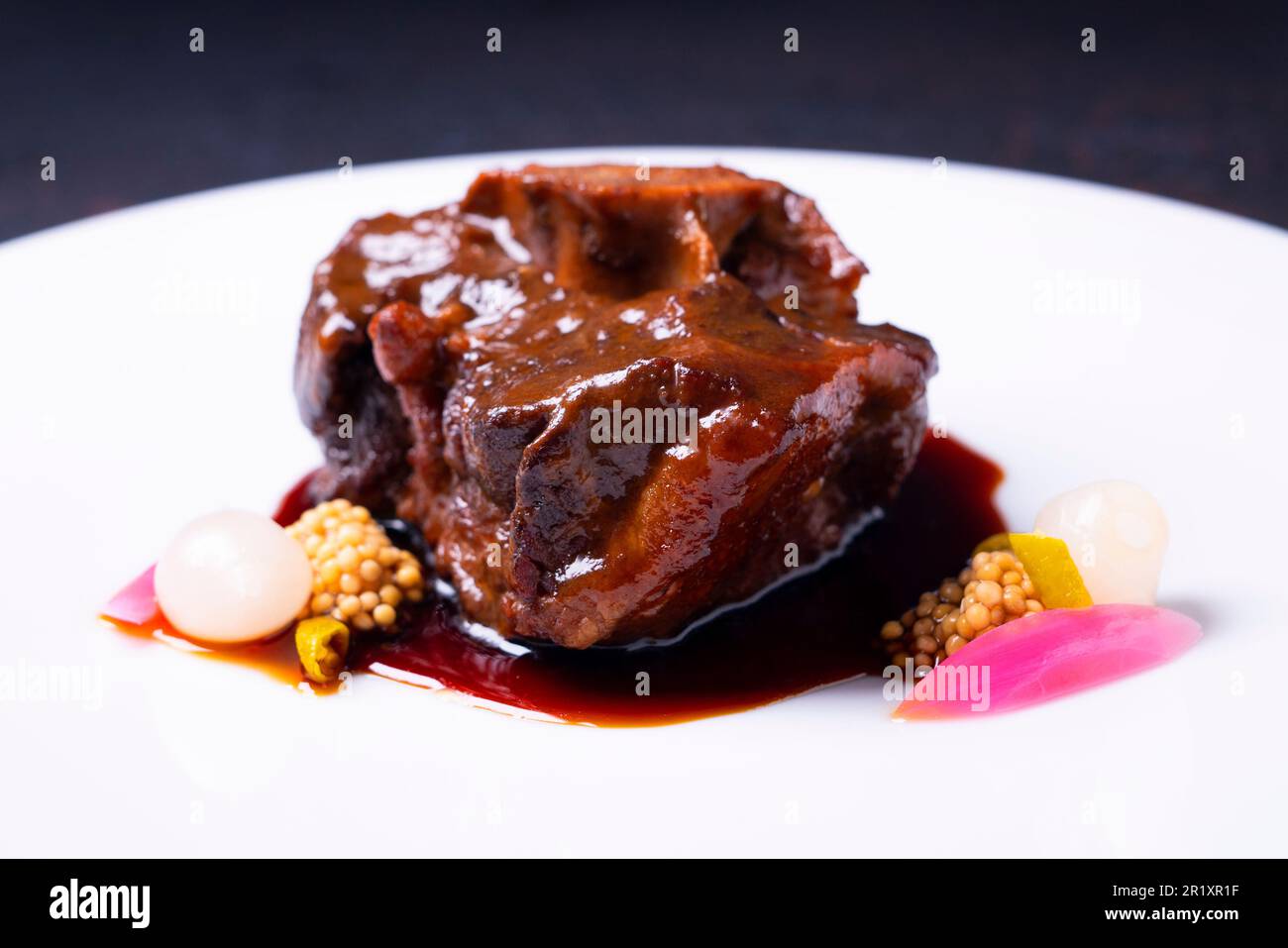 Oxtail dish cooked with red wine sauce. Spanish tapa recipe Stock Photo ...