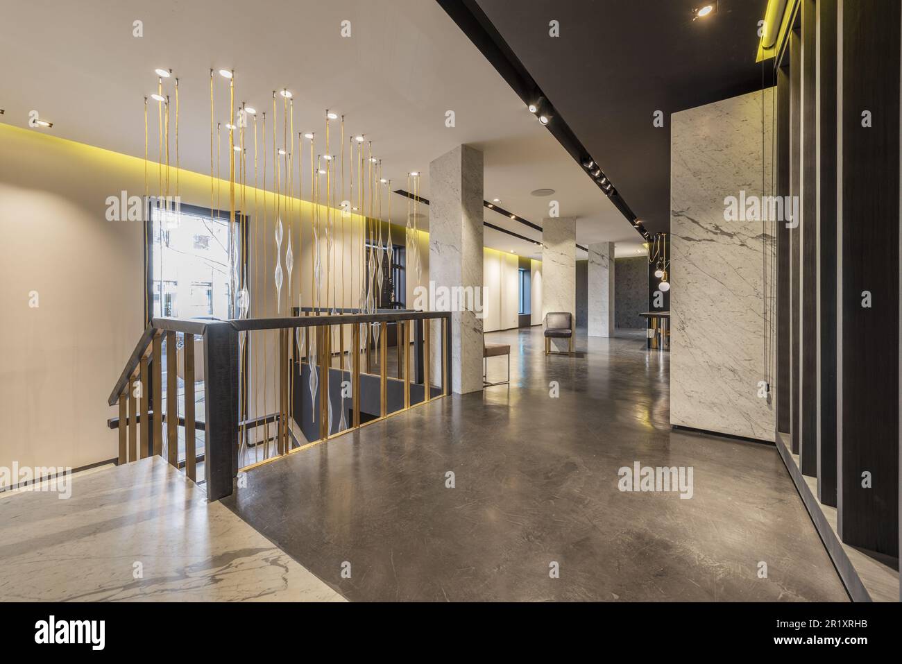 An empty retail space with polished concrete floors and ceiling ...