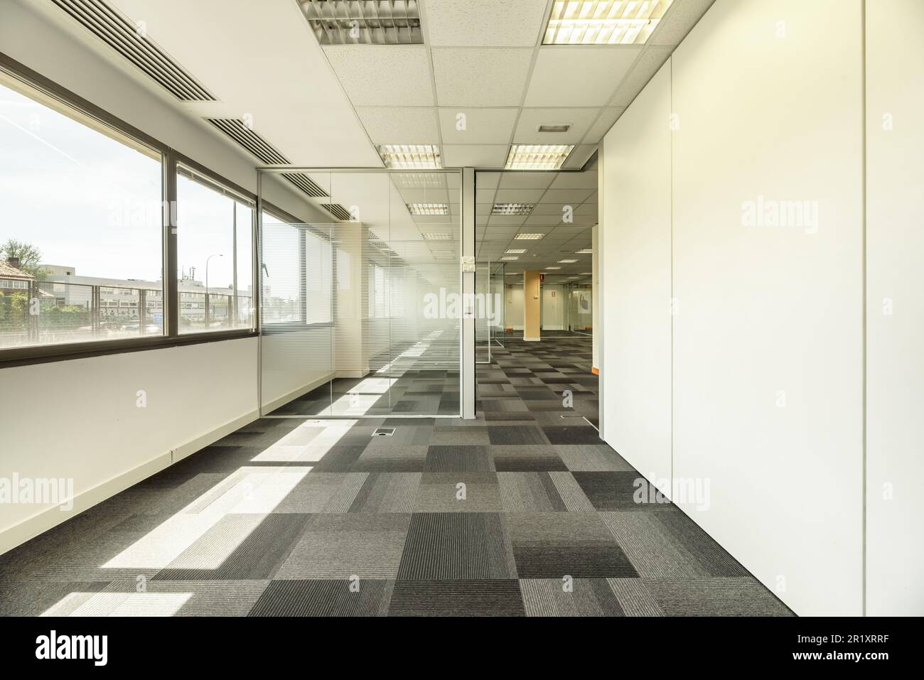 Some offices with glass partitions, large windows, technical ceilings ...