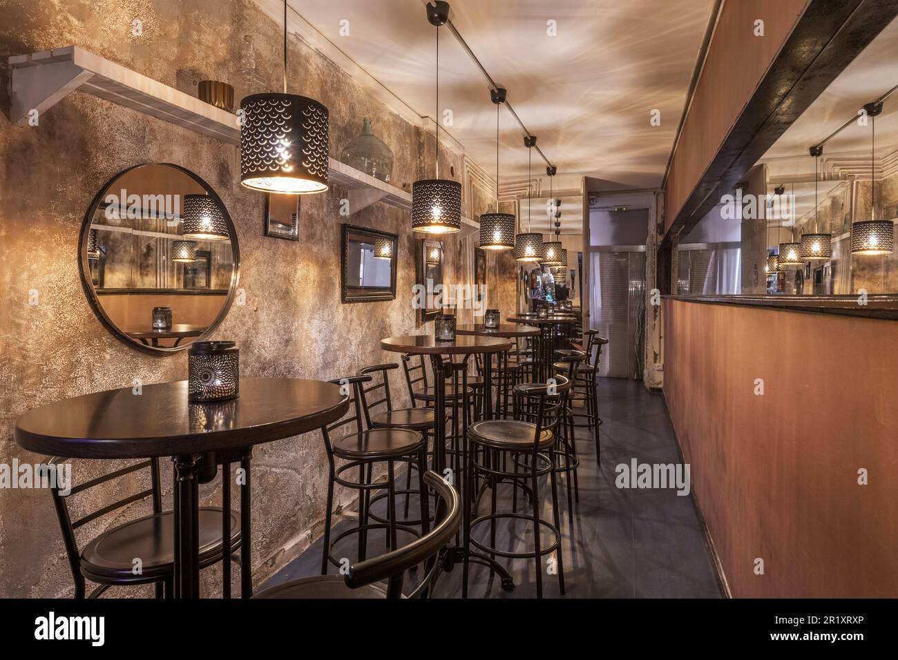 A group of circular high top tables with matching stools in a late ...