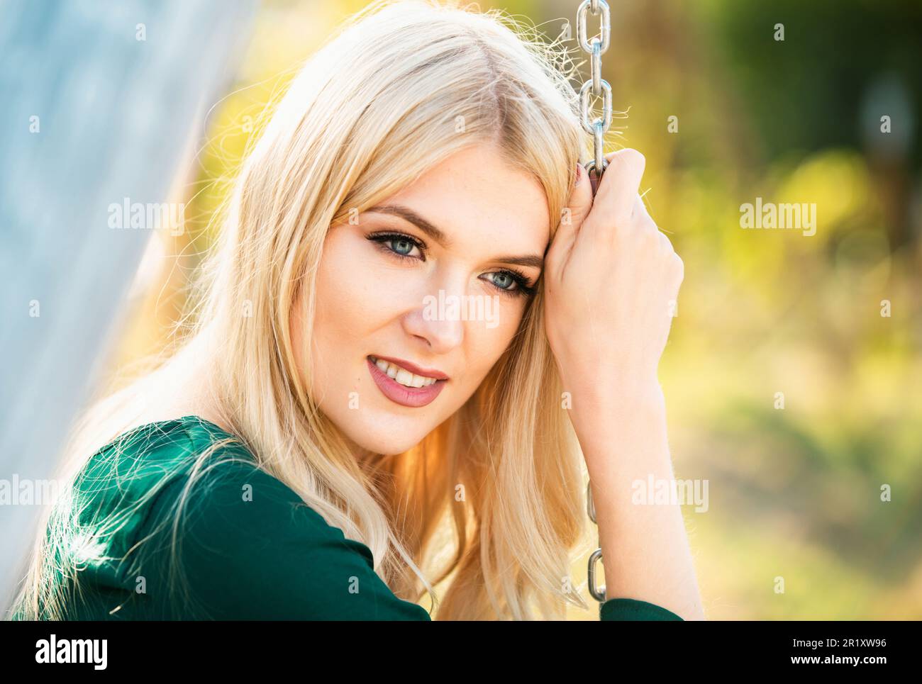 Portrait of beautiful blonde romantic young woman. Outdoor portrait of ...