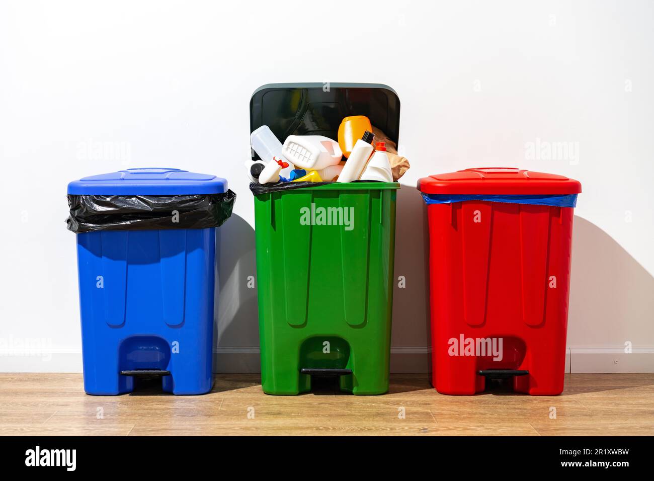 Trash cans full of waste in the building Stock Photo - Alamy