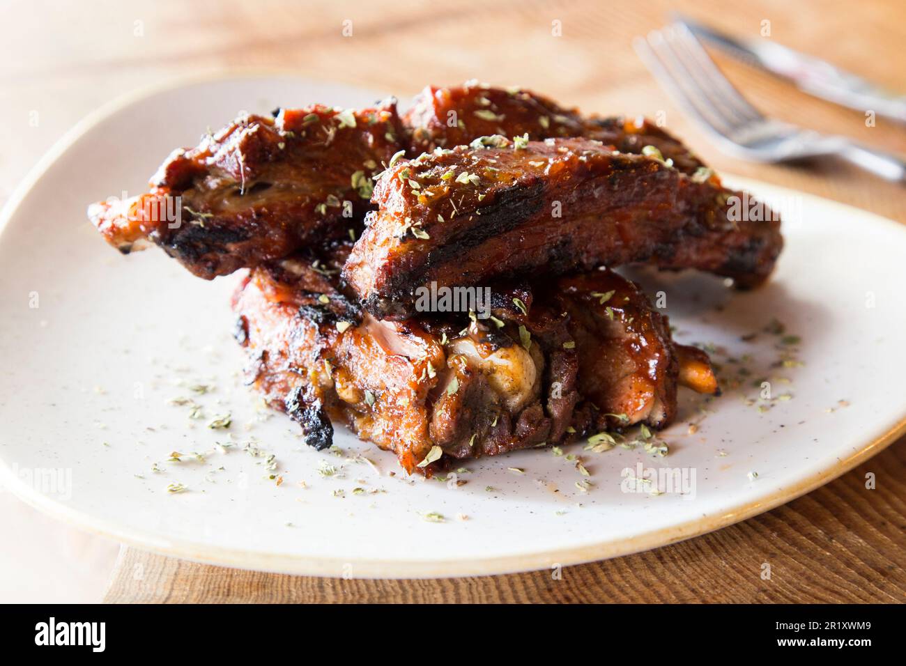 Braised pork ribs on a barbecue Stock Photo - Alamy