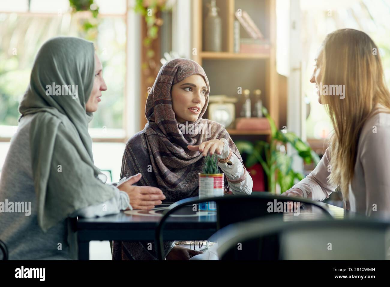 Girl in hijab talking to group hi-res stock photography and images - Alamy
