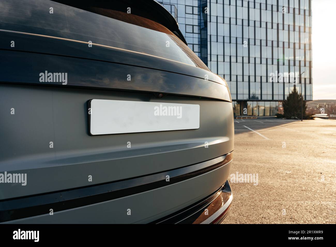 Rear side view of new luxury car Stock Photo - Alamy