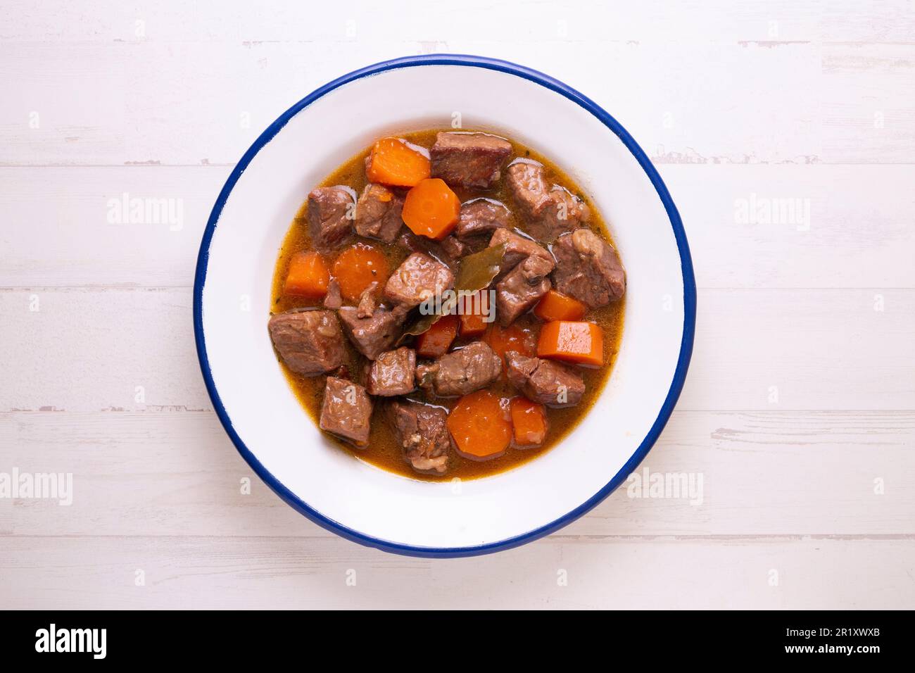 Stewed beef with potatoes and vegetables. Traditional Spanish tapa ...