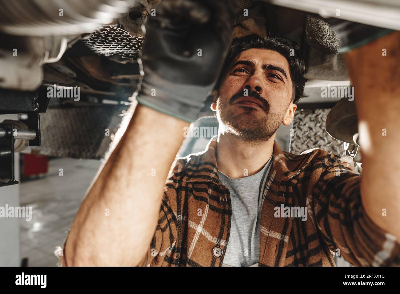 Auto mechanic checking running gear hi-res stock photography and images ...