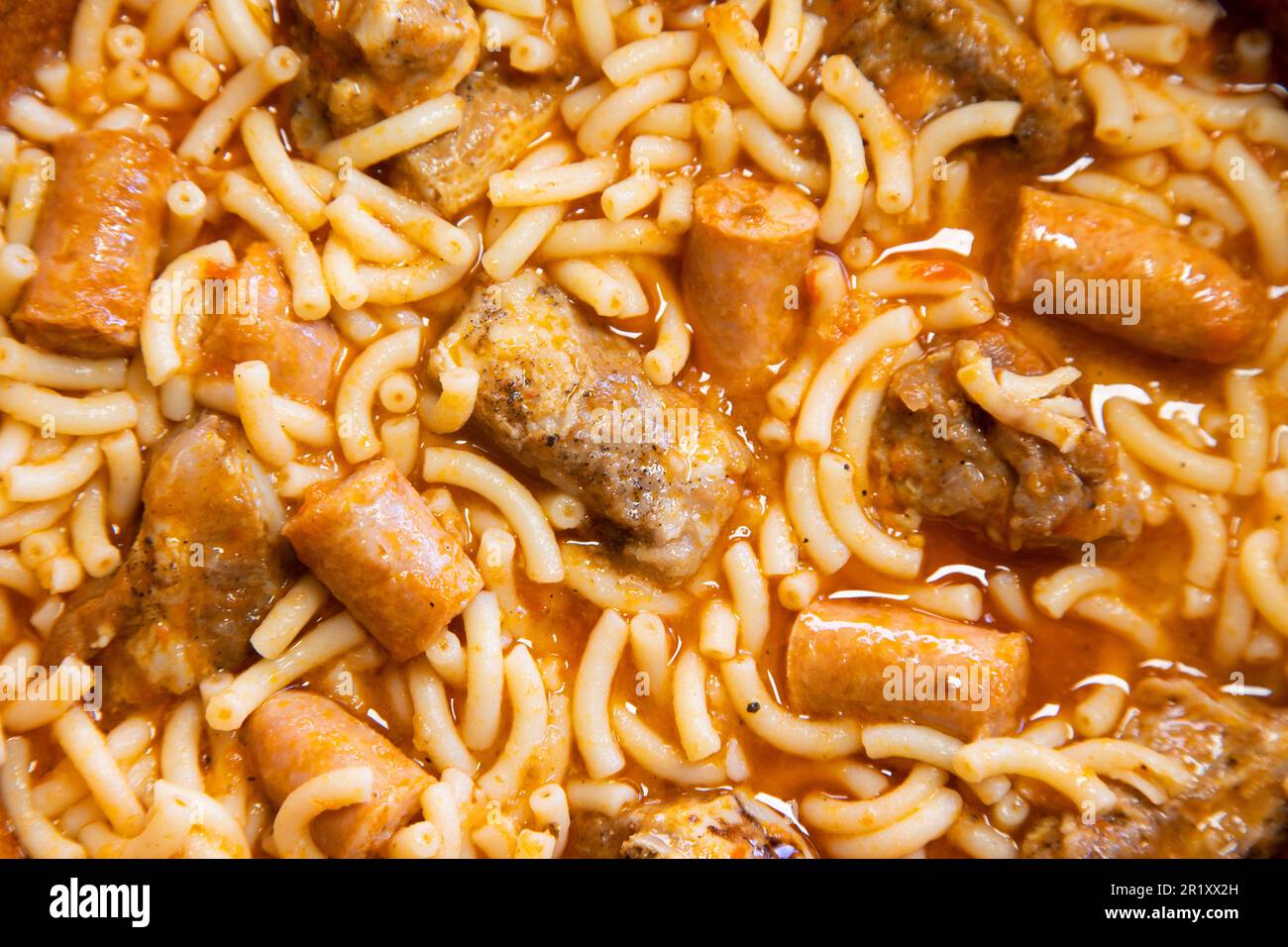 Paella fideua with pork. Fideuá is a dish originally from Gandía that ...