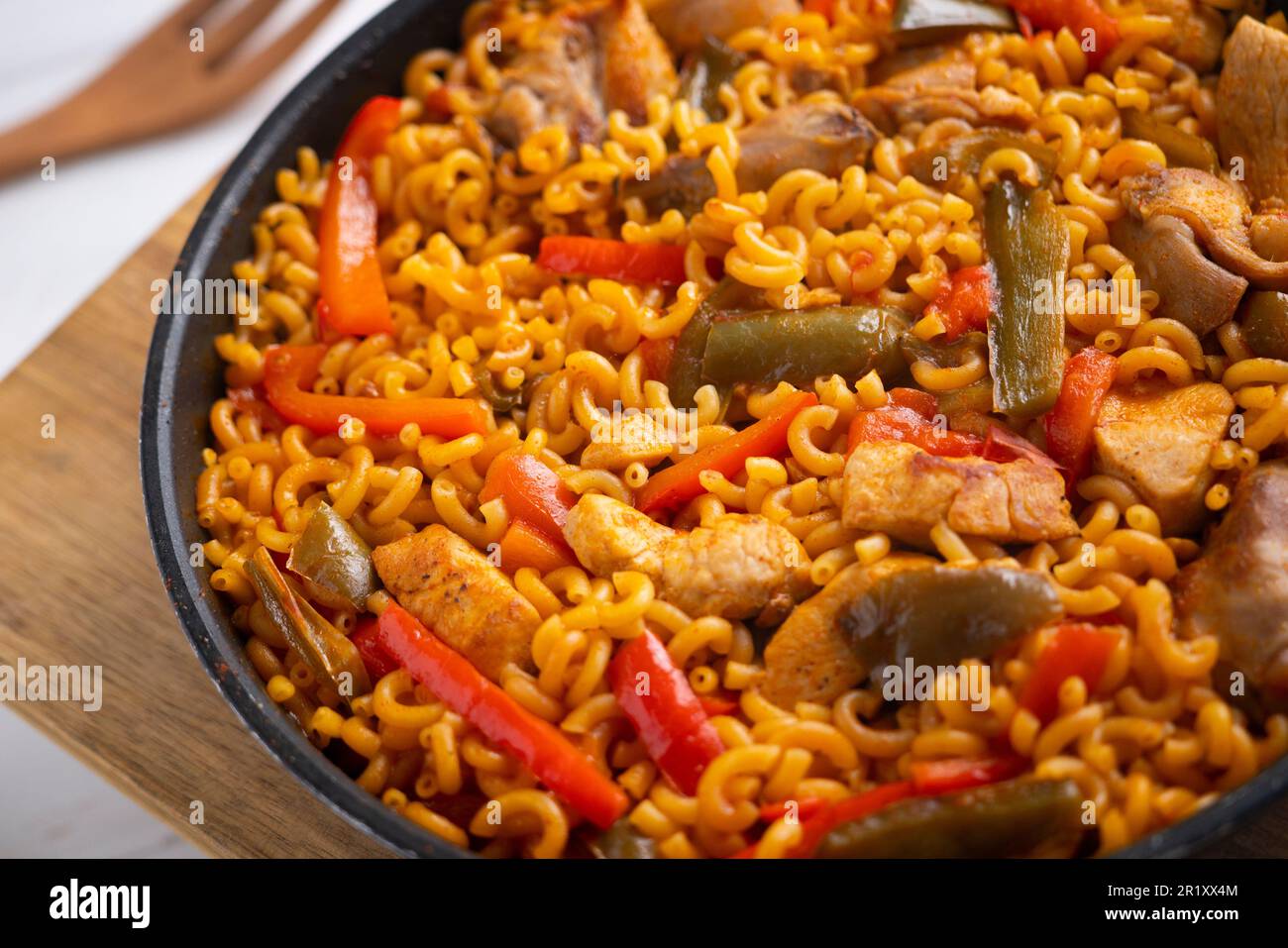 Paella fideua with chicken.Fideuá is a dish originally from Gandía that ...