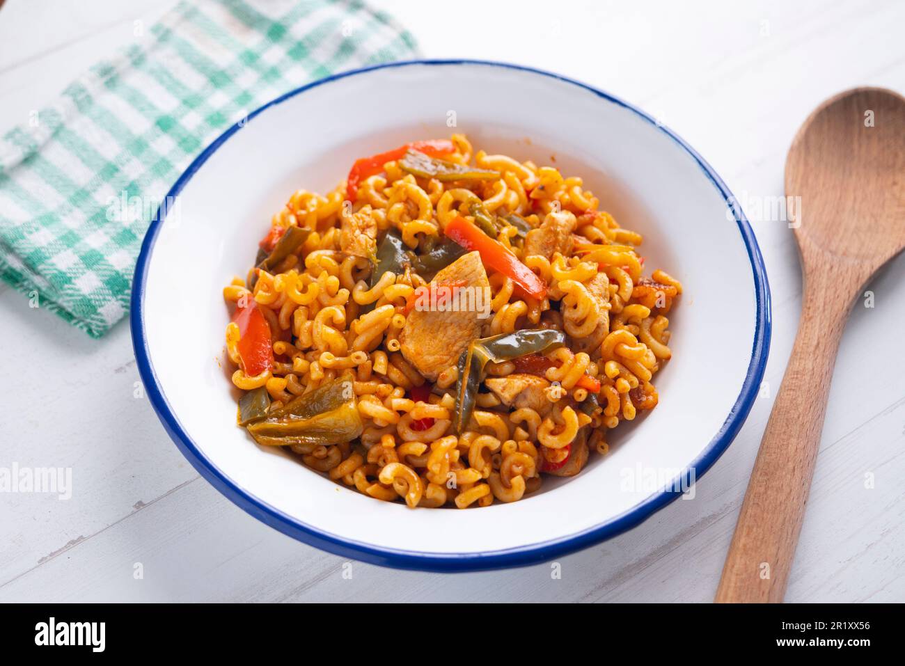 Paella fideua with chicken.Fideuá is a dish originally from Gandía that ...