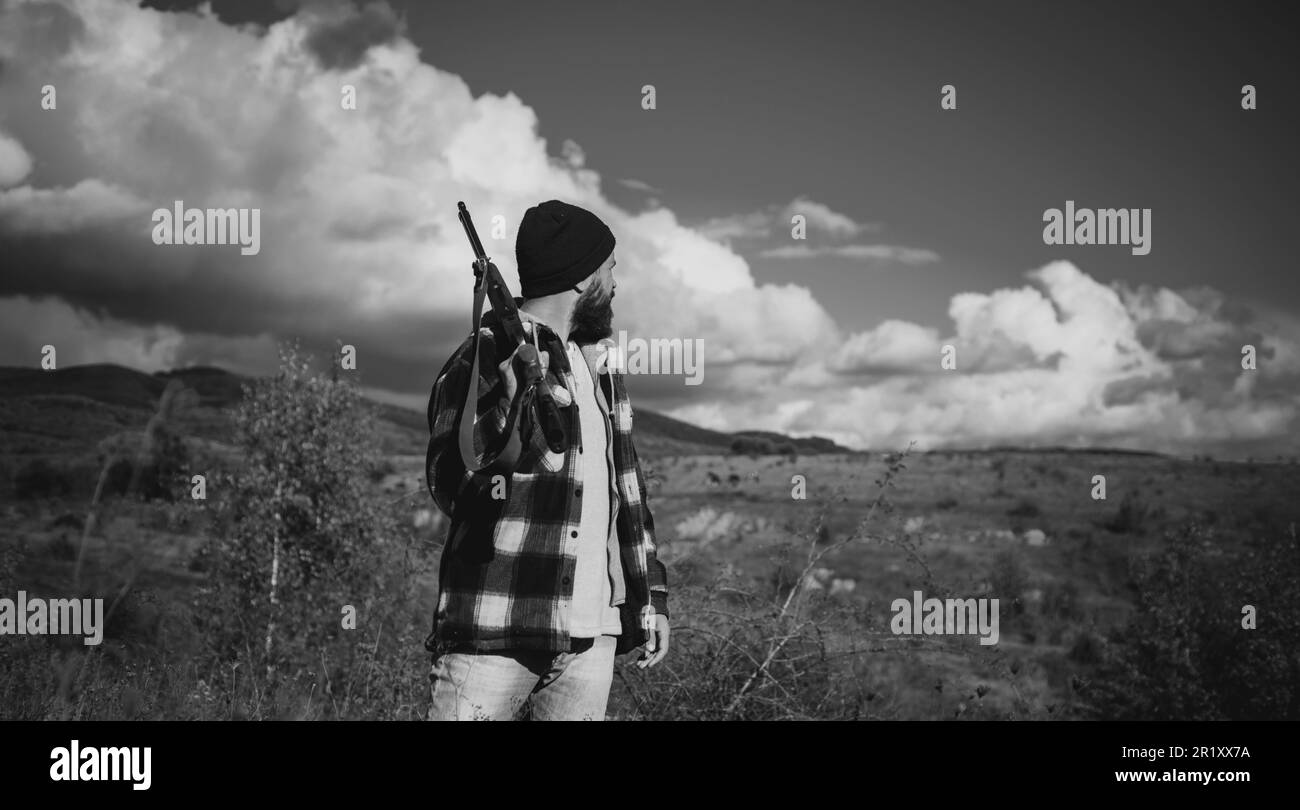 Hunter with shotgun gun on hunt. Autumn hunting season. Poacher with ...