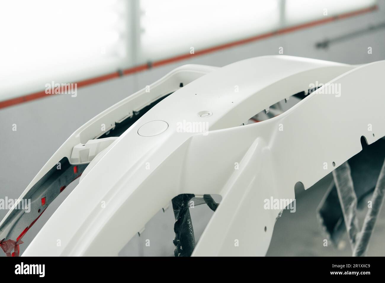 Spare parts for the car body in car repair service Stock Photo - Alamy