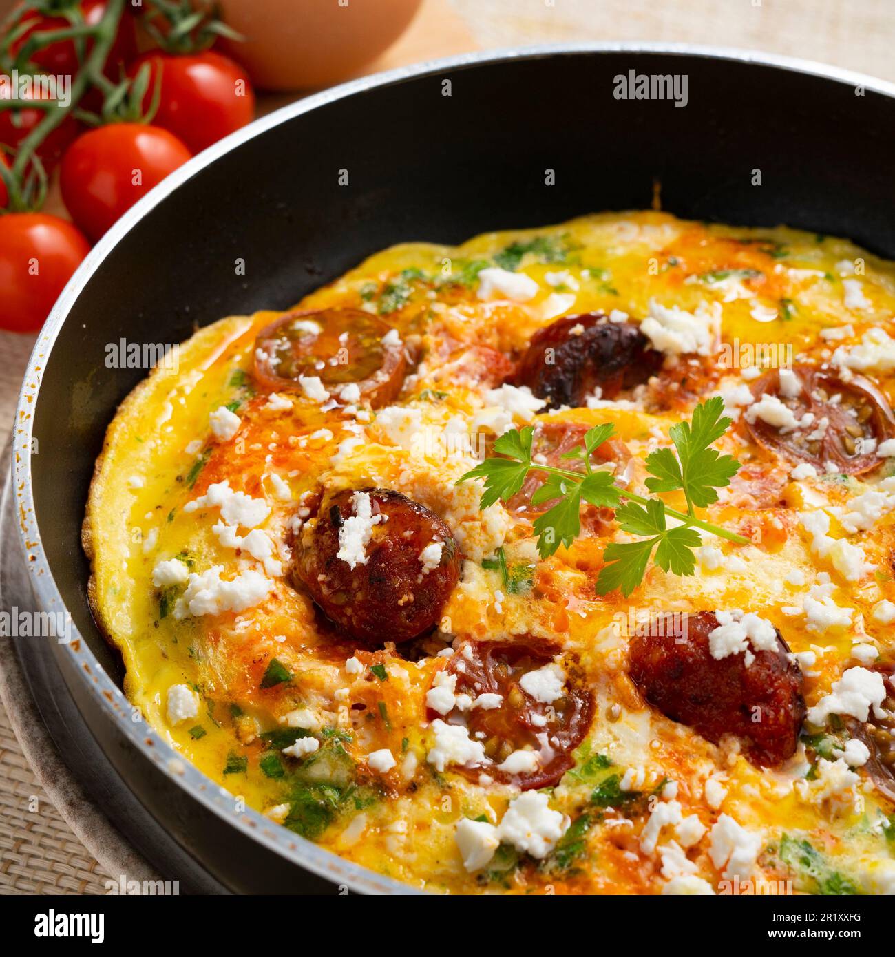 Traditional frittata with pork chorizo and vegetables Stock Photo - Alamy