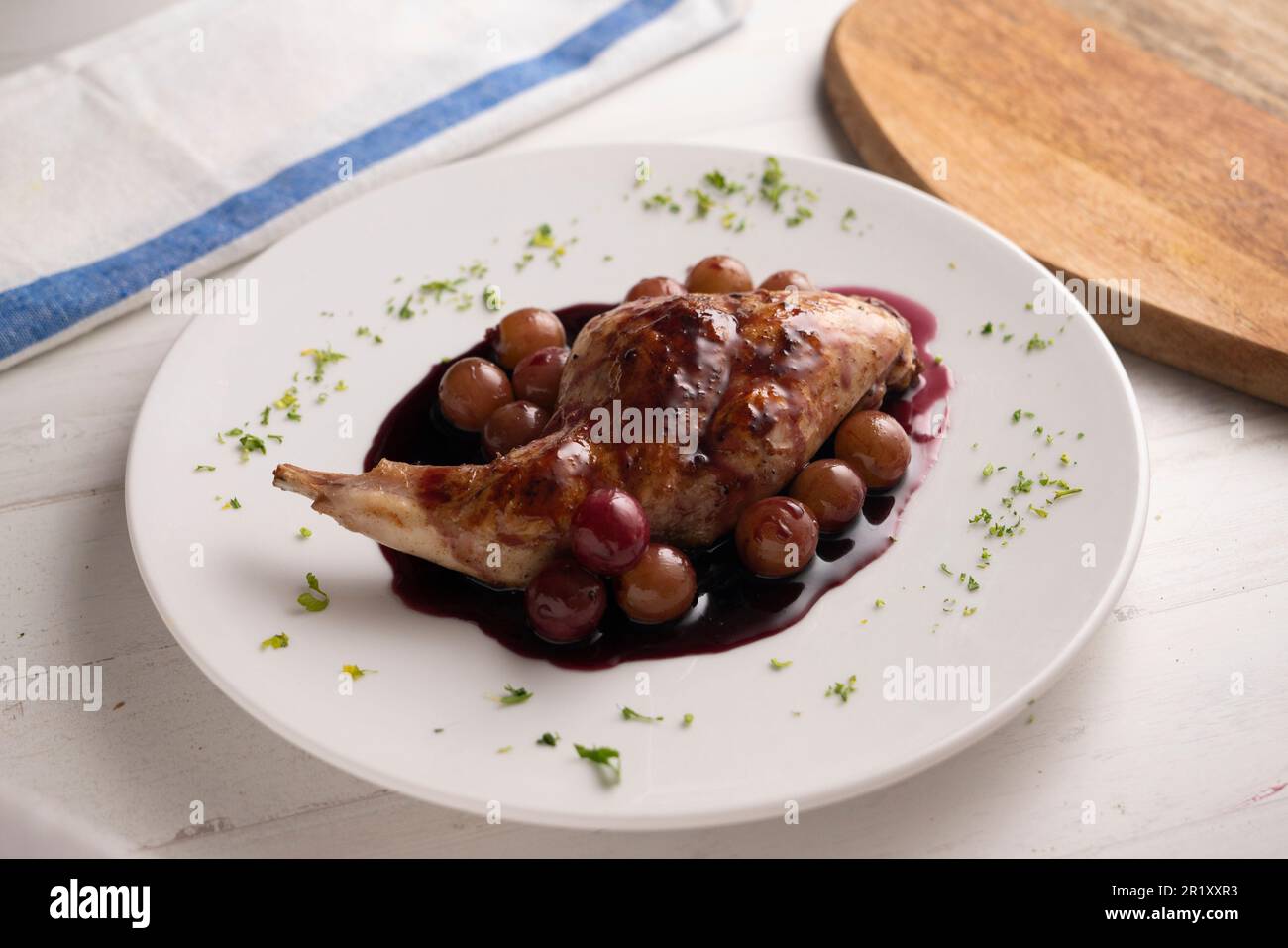 Wild rabbit cooked with wine sauce. Traditional recipe in Spain Stock ...