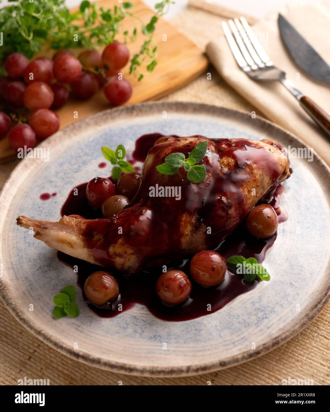 Wild rabbit cooked with wine sauce. Traditional recipe in Spain Stock ...