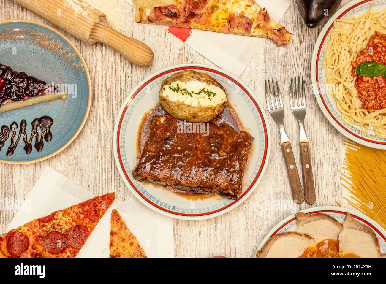 A set of delicious dishes starring a roasted leg and ribs with barbecue ...