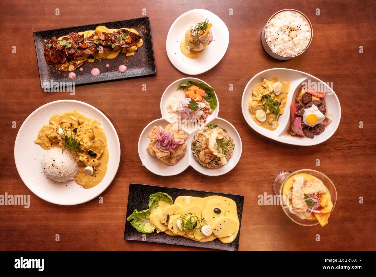 Set of Peruvian cuisine dishes with cebiches, leche de tigre, potato ...