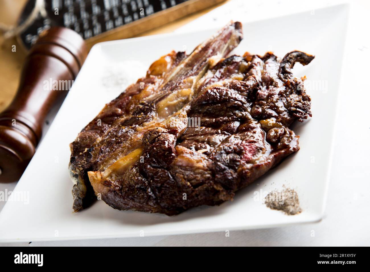 Premium veal T-bone steak cut in a restaurant in the Basque Country in ...