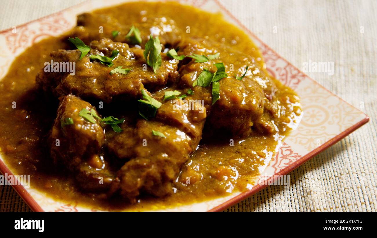 Stewed cheek with sauce. Traditional Spanish tapa recipe Stock Photo ...