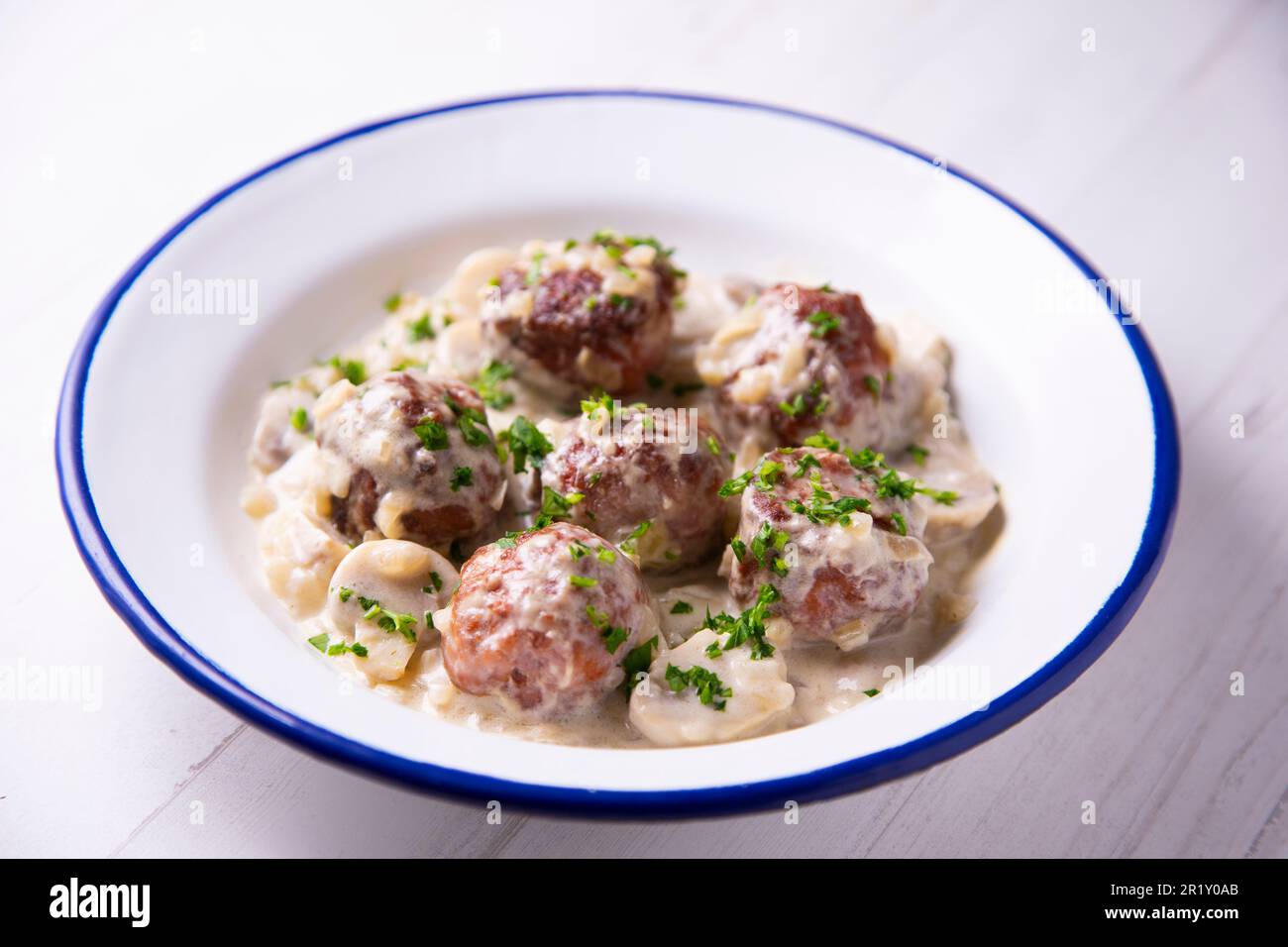 Meatballs with white sauce. A meatball is a popular culinary ...